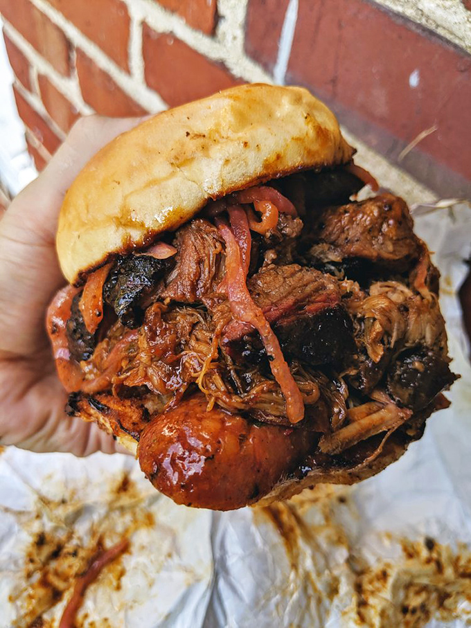 Behold: the sandwich that launches a thousand road trips. This pulled pork doesn't just fall apart—it surrenders with dignity.