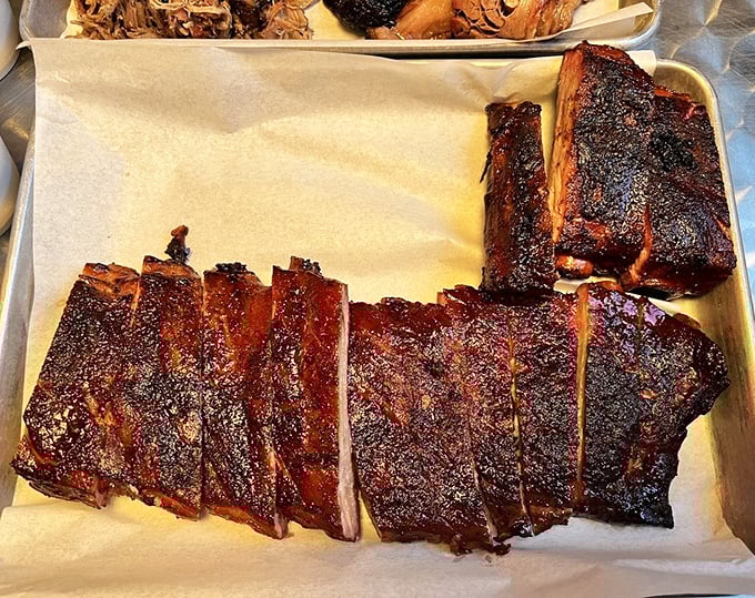 These ribs don't just fall off the bone—they make a compelling argument for skipping your next dental appointment. The bark alone is worth the drive.