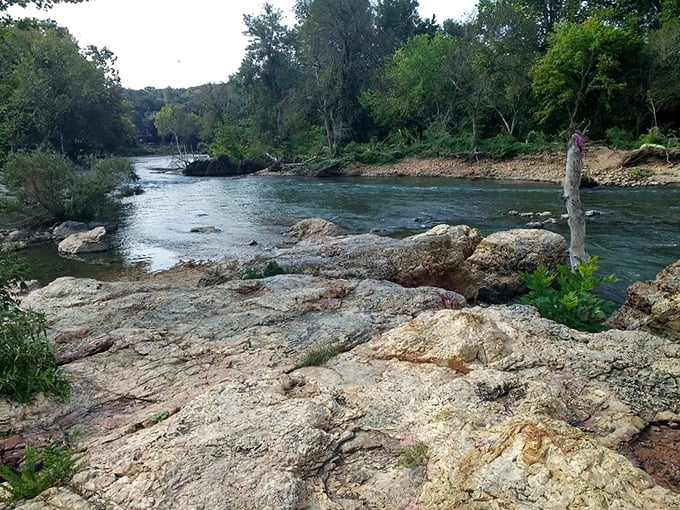 Shoal Creek's calmer personality downstream offers peaceful moments after the dramatic performance of the falls—nature's perfect cool-down area.