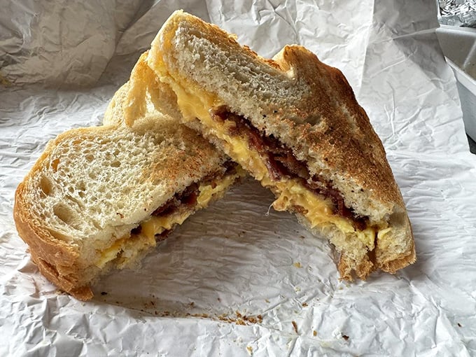 Behold the sandwich that turns skeptics into believers – layers of perfection between slices of homemade bread.
