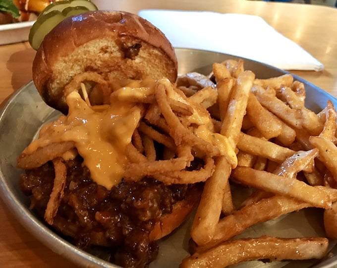 The sandwich that launched a thousand road trips. This isn't your cafeteria lady's Sloppy Joe—it's a masterpiece of meaty perfection on a sturdy kaiser roll.