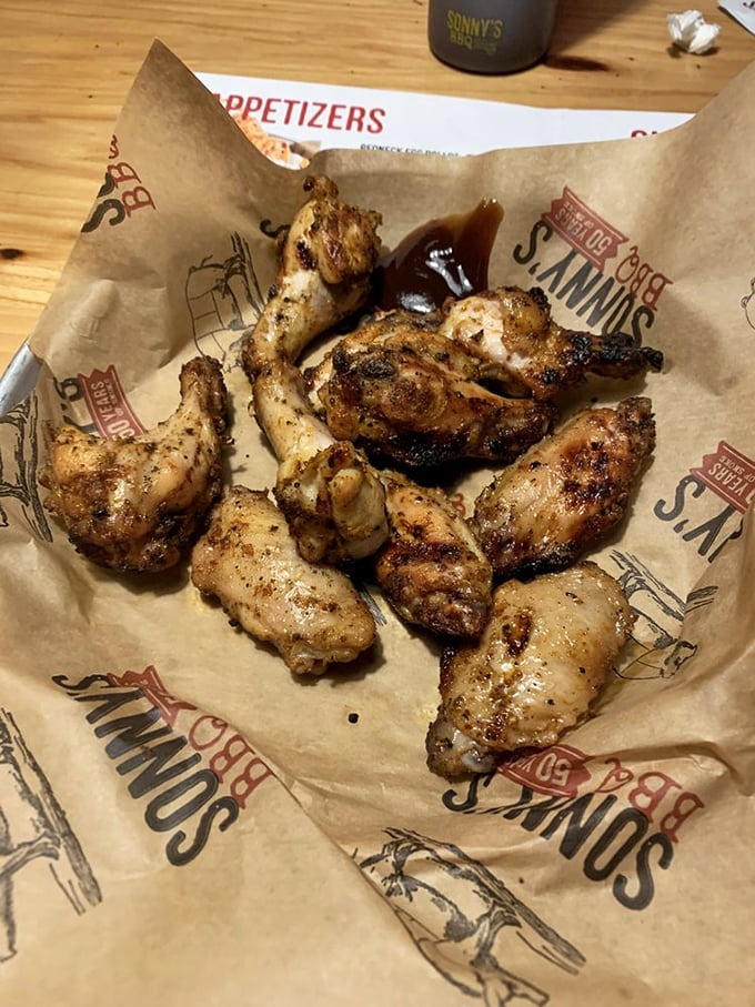 These wings aren't just smoked—they've had a spiritual experience in the pit. Crispy, seasoned perfection that makes you wonder why you'd eat wings any other way.