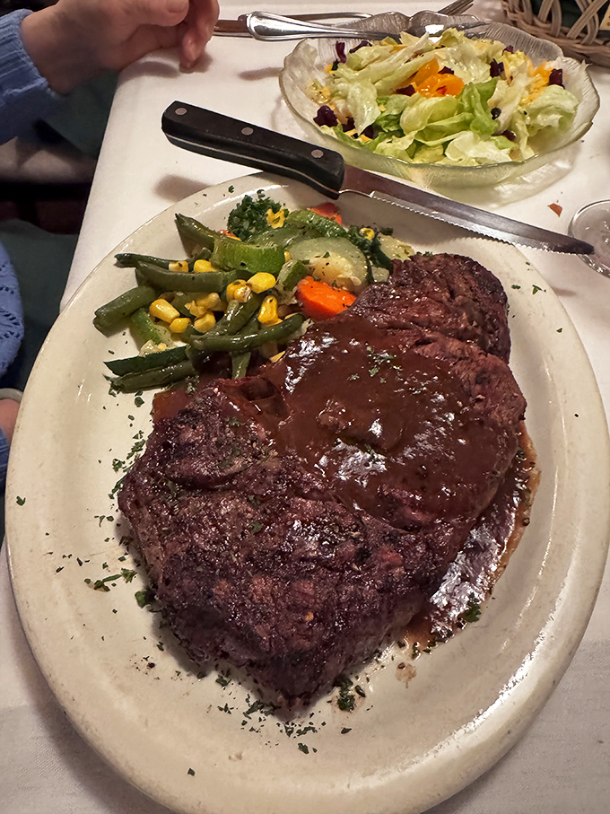 Behold the steak that launched a thousand road trips. That perfect char, that juicy center—this isn't dinner, it's performance art with beef as the star.