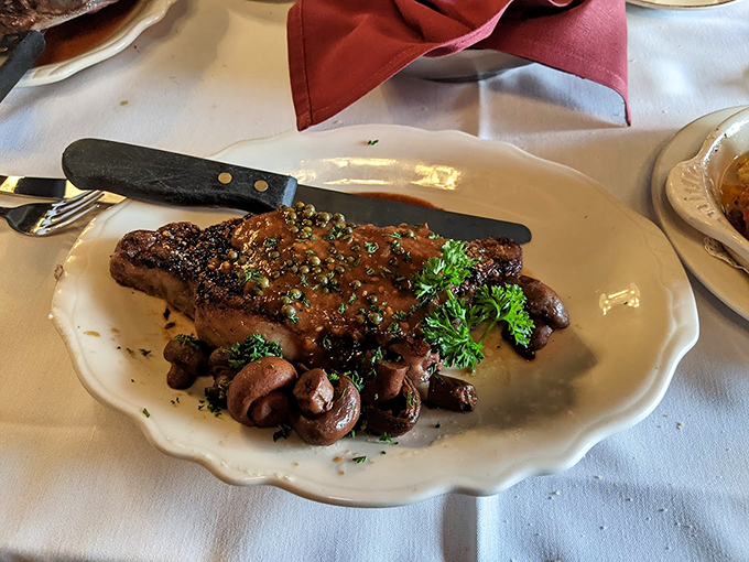 A perfectly seared steak with mushrooms that didn't just accompany the meat – they earned their place at the table through sheer deliciousness.
