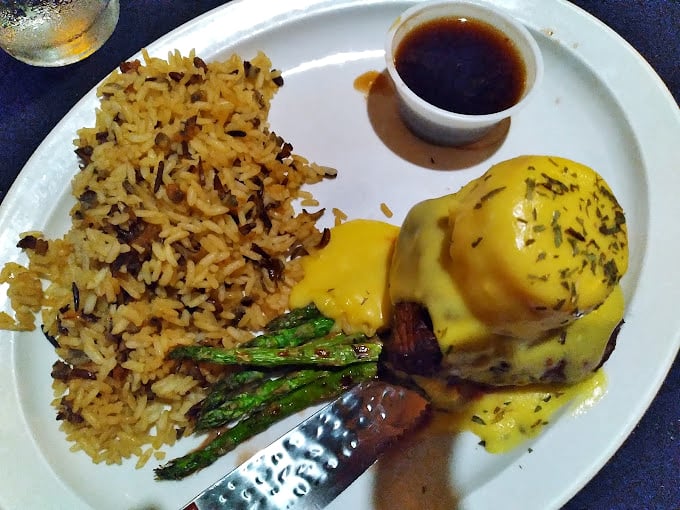 Behold the Steak Oscar in all its glory—a tender filet crowned with asparagus and crab, bathed in hollandaise that would make a French chef weep with joy.