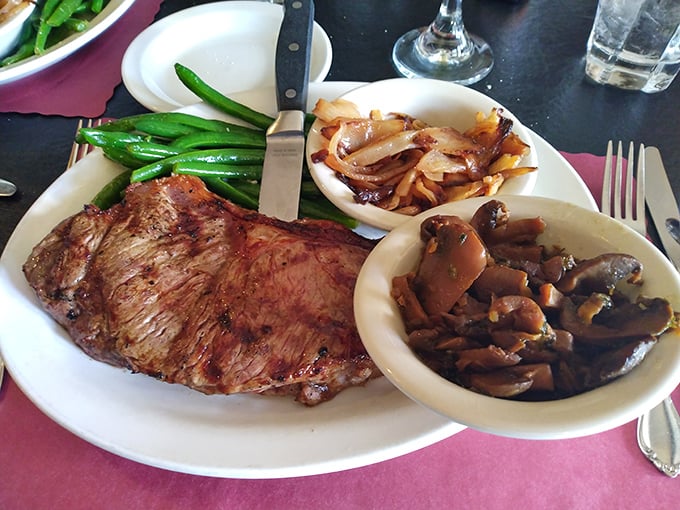 Carnivore's delight: A perfectly seared steak flanked by vibrant green beans and mushrooms sautéed to earthy perfection. Simple food done right never needs explanation.
