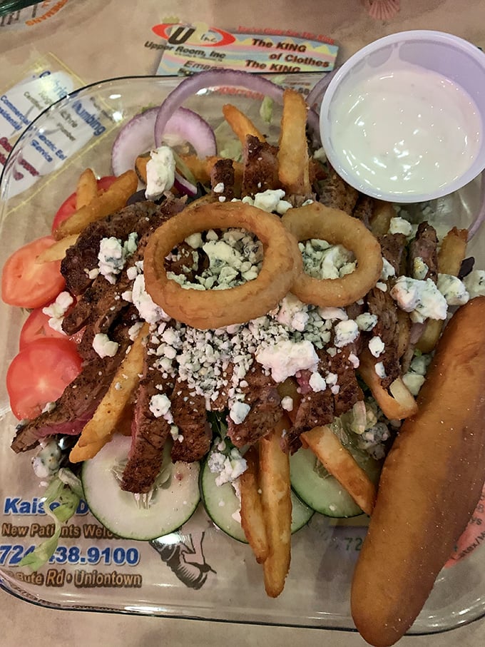 Behold the legendary steak salad—where perfectly seasoned beef, garden-fresh veggies, blue cheese crumbles, and yes, those glorious fries create Pennsylvania's most perfect food pyramid.