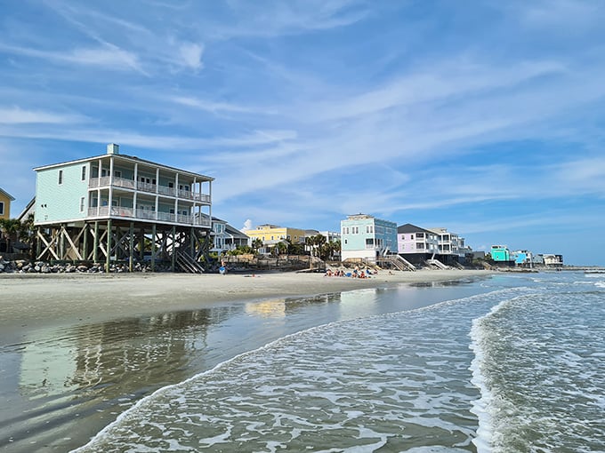 Where the waves meet pastel-colored beach homes. This isn't just waterfront property – it's where everyday life gets its own picture-perfect backdrop.