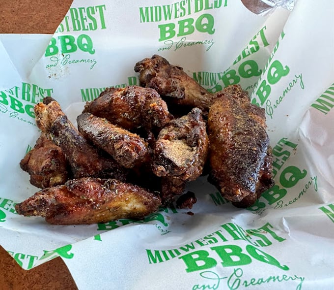 Smoke-kissed wings with a perfect dry rub that would make angels weep. These aren't just wings; they're the reason speed limits exist on the drive home.