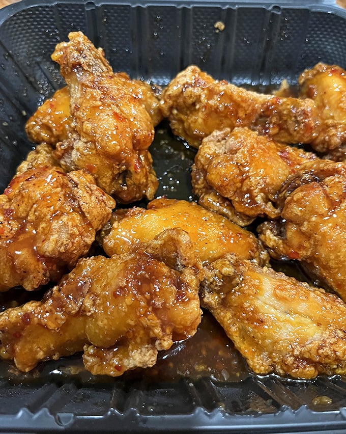 Golden wings glistening with sauce – proof that sometimes the best things come in the simplest packages.