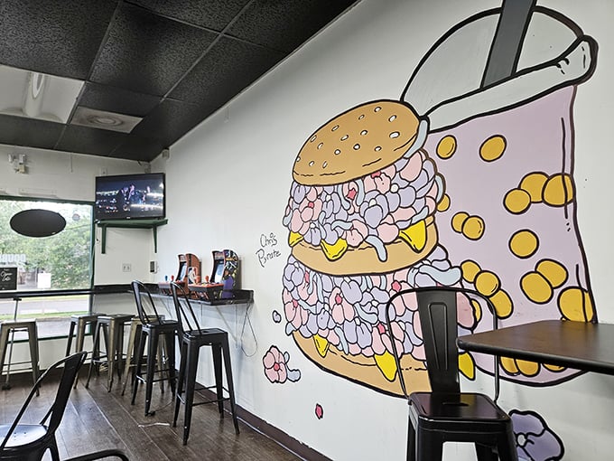That burger mural isn't just decoration—it's a promise. Double Up's cozy interior focuses on what matters: seriously good food.