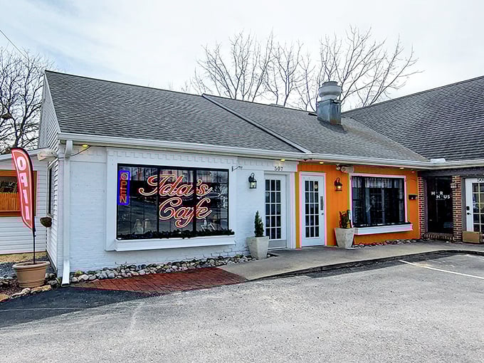 Ida's Cafe's cheerful orange accent wall is like a sunrise promise that your day is about to get better, one perfect bite at a time.