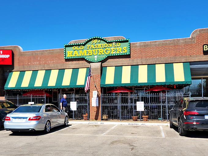Those green and yellow awnings aren't just decoration – they're a signal flag for serious burger enthusiasts.