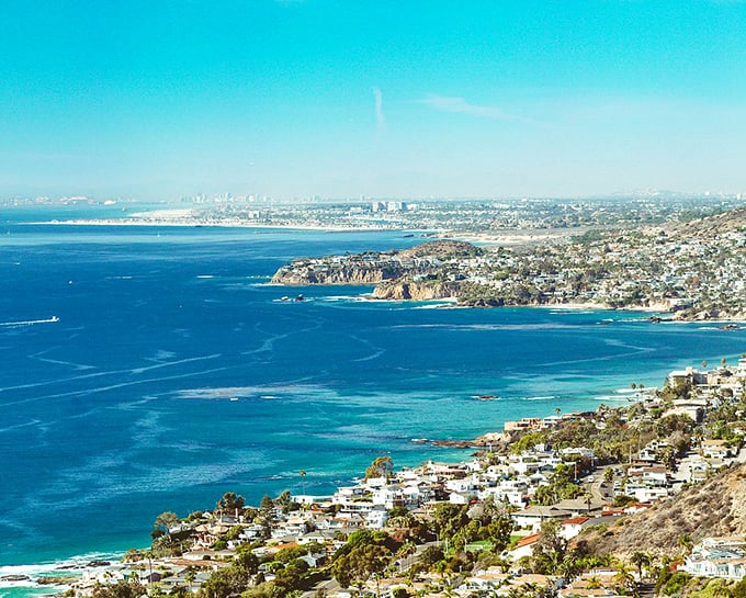 Laguna Beach homes climbing hillsides like they're competing for the best sunset seats.