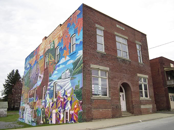 Bold colors and rich history—this mural in Mount Jewett turns a brick wall into a vibrant celebration of Pennsylvania’s past and culture.