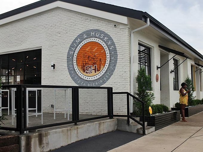 Slim & Husky's crisp white exterior hides a pizza revolution within. Modern design meets old-school pizza passion in this Nashville hotspot.