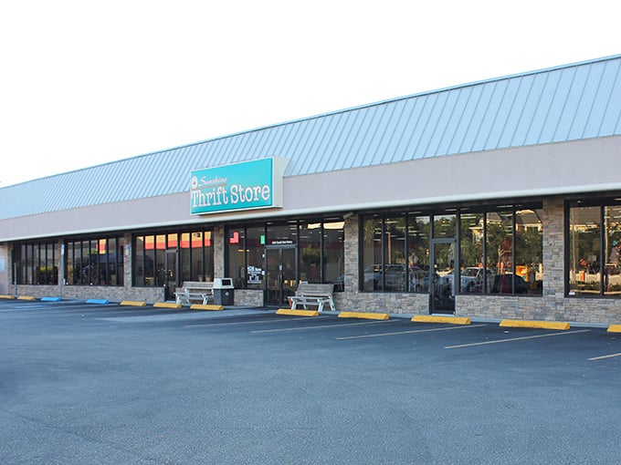 Sunshine Thrift Store lives up to its name with a bright blue roof that signals "bargain paradise ahead!"