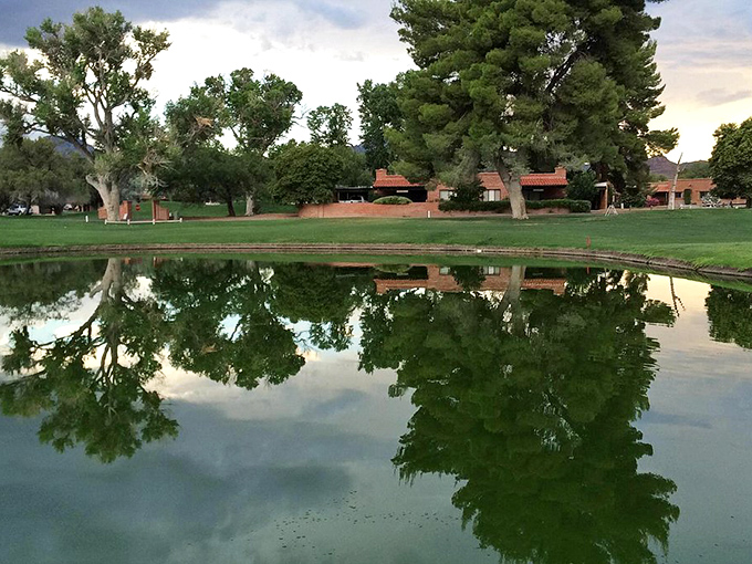 The historic Tubac Presidio building stands as a sun-drenched reminder of Arizona's Spanish colonial past against mountain backdrops.