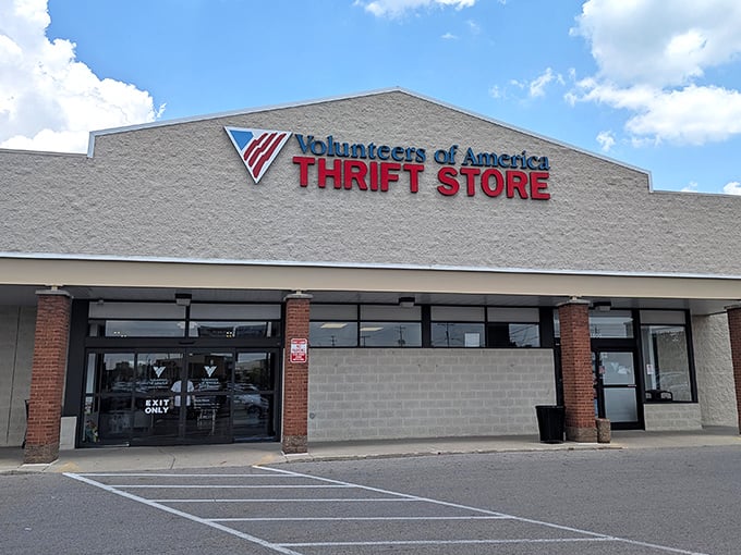 Volunteers of America's patriotic signage stands proud against the sky. Red, white, blue, and green—the color of money you'll save inside!
