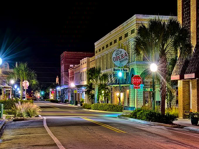 Night falls on Arcadia's Opera House like a velvet curtain, illuminating a stage where history performs nightly under the watchful gaze of palms.