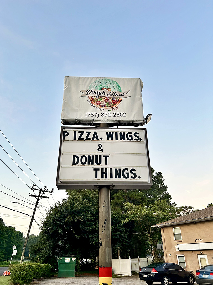 The sign promises pizza, but locals know the real morning magic happens when those donut fryers fire up. Sweet and savory paradise!