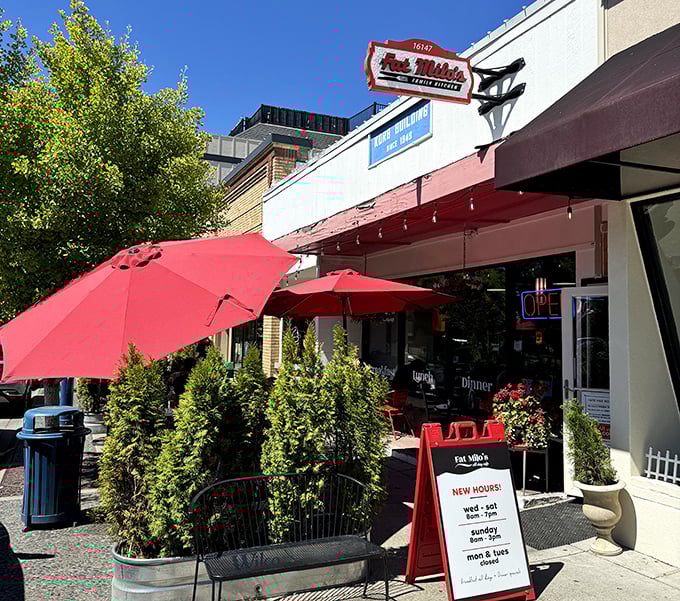 Red umbrellas and outdoor seating at Fat Milo's create the perfect stage for breakfast theater.