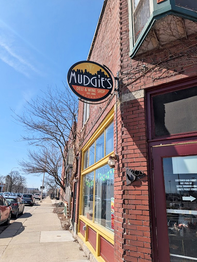 Sunshine highlights Mudgie's distinctive sign – a beacon of sandwich excellence in Detroit's historic Corktown.