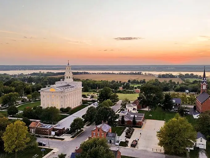 Nauvoo's stunning temple dominates the skyline, a gleaming testament to faith and craftsmanship overlooking the Mississippi River.