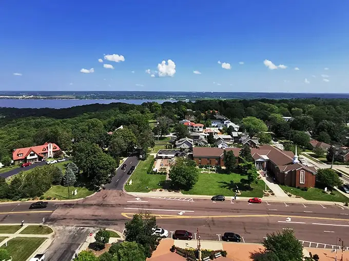 That church spire reaches toward heaven while downtown Peoria keeps both feet firmly planted in Midwest practicality.