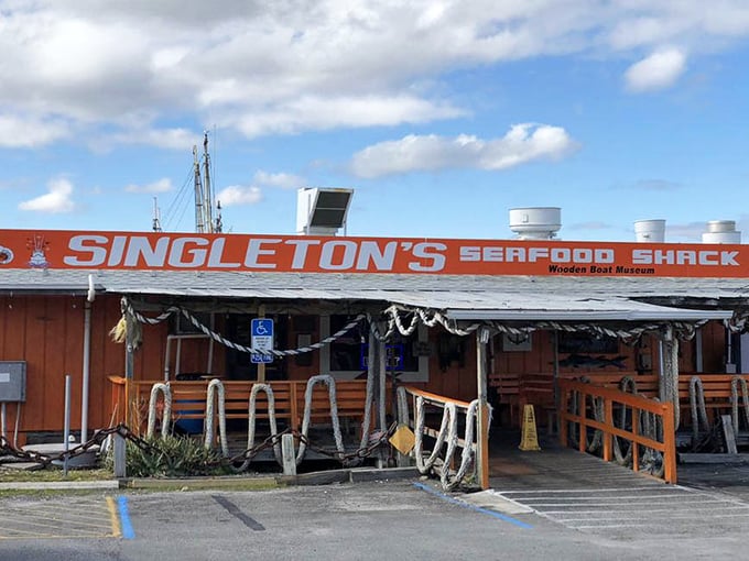 This is what "authentic Florida seafood shack" looks like – complete with fishing nets and zero pretense.