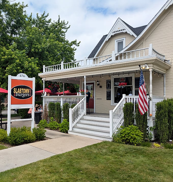 That welcoming porch and American flag – Slabtown Burgers isn't just selling food, it's offering a slice of Michigan nostalgia.