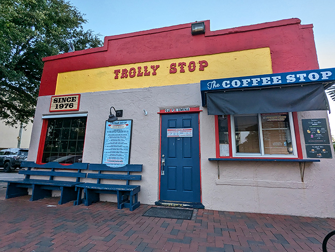 Blue benches await hot dog pilgrims at this coastal landmark. The bright facade is almost as cheerful as you'll feel after eating here.