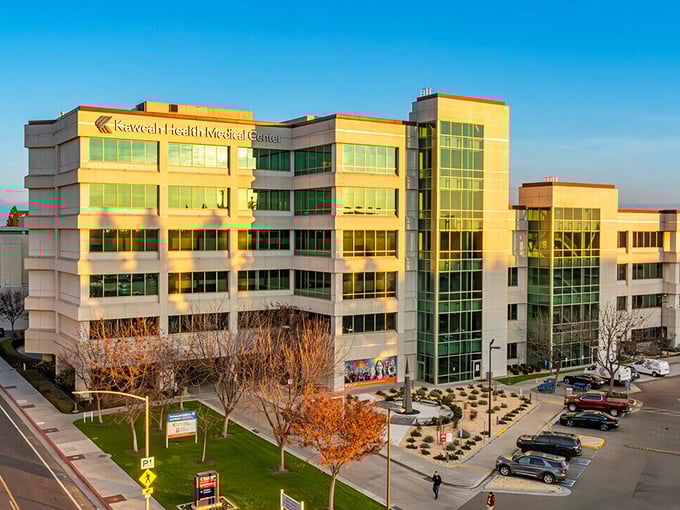 Kaweah Health Medical Center gleams in golden hour light—where modern healthcare meets California sunshine.