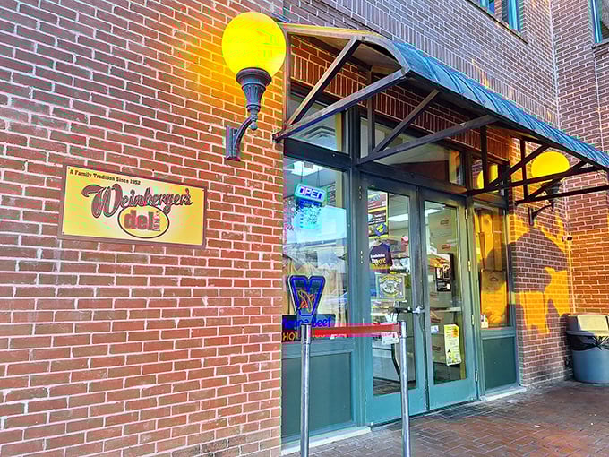 Those glowing yellow lamps welcome sandwich pilgrims to Weinberger's. The Chicago-style subs inside are worth the journey!