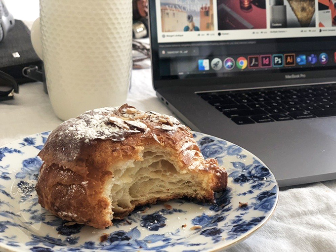 The cross-section tells the whole story – those honeycomb air pockets are the mark of perfect lamination. This croissant could make a Parisian homesick.