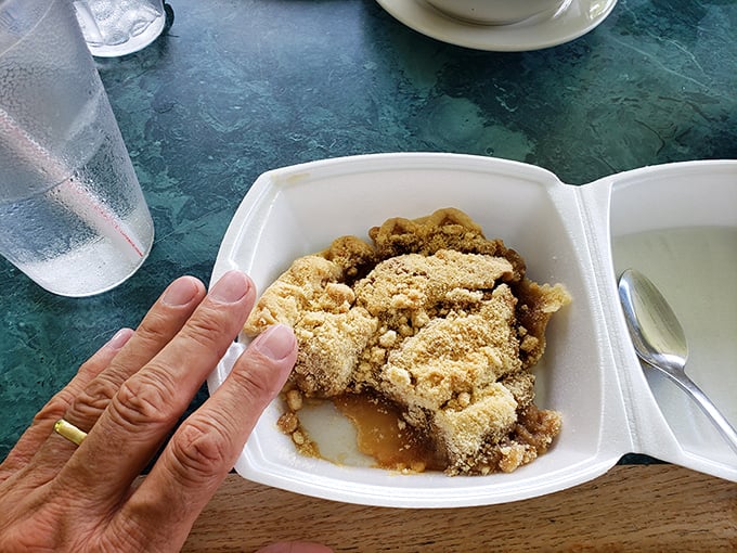The apple dumpling arrives like a warm hug from grandma—crumbly, sweet, and absolutely worth every calorie-laden bite.
