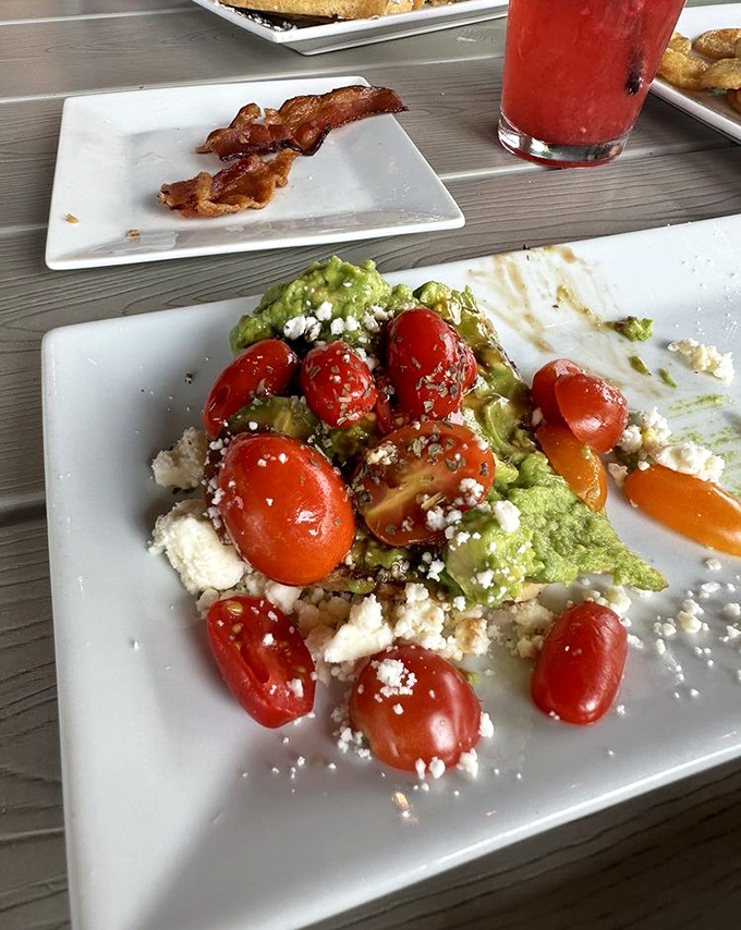 Avocado toast that Instagram dreams are made of. Those cherry tomatoes pop with color and flavor like tiny flavor bombs.