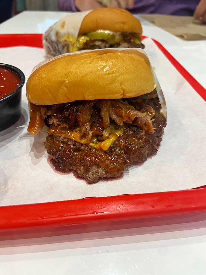 The BBQ Burger—where two culinary worlds collide in spectacular fashion. Pulled pork atop a beef patty is the crossover episode we didn't know we needed.