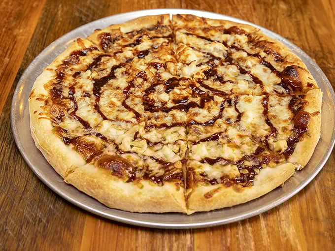 BBQ chicken pizza with that hypnotic spiral of sauce—like the Twilight Zone of flavor, but you'll happily get lost in it.
