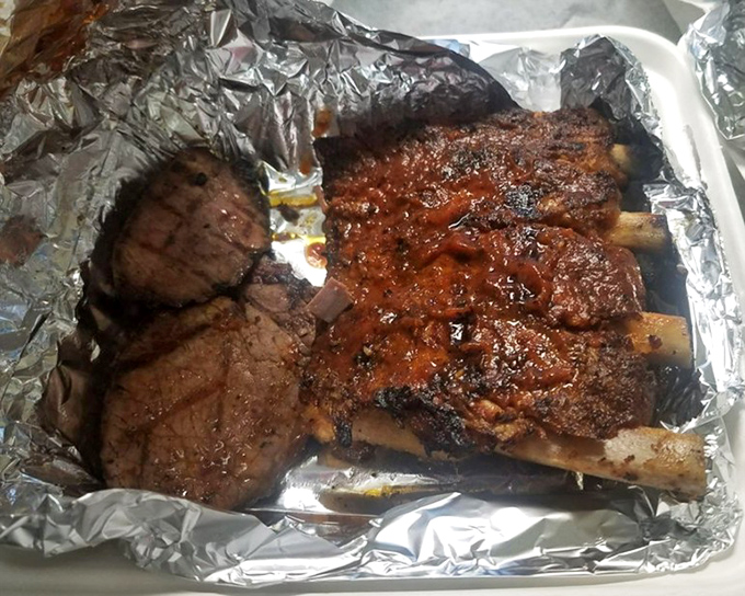 Behold the carnivore's dream: ribs and brisket nestled in foil, their bark glistening with promise like the Hope Diamond of meat.