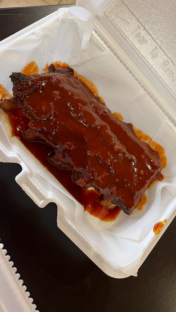 These sauce-slathered ribs aren't just food—they're an edible love poem to patience. The glossy coating promises a sweet-tangy symphony that'll have you licking your fingers shamelessly.