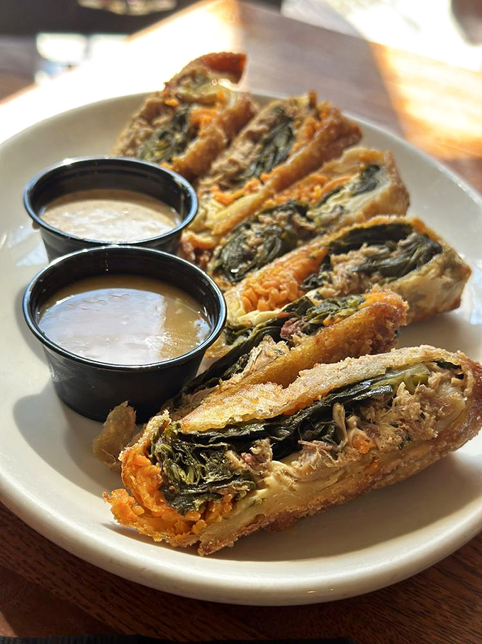 Soul rolls reinvent Southern classics by wrapping collards and pulled pork in a crispy shell—like your grandmother's cooking got a delicious promotion.