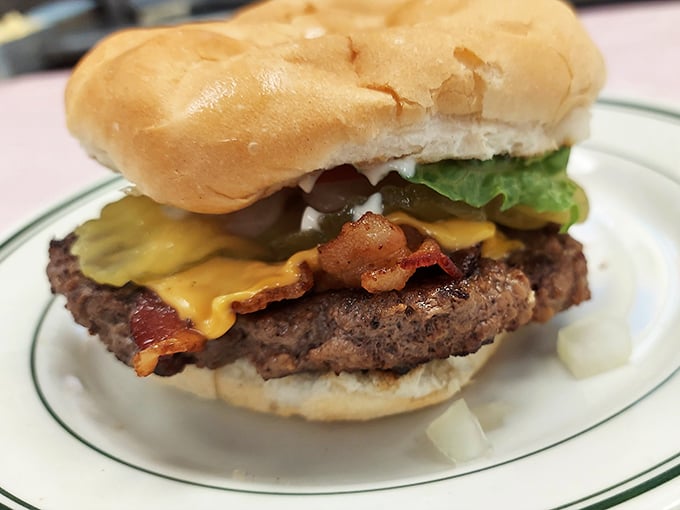 This isn't just a bacon cheeseburger—it's architecture. The perfect stack of beef, cheese, and bacon that makes you wonder why anyone bothers with fancy food.