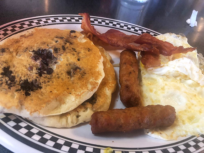 When pancakes, eggs, and bacon share a plate, it's not just breakfast—it's a morning symphony conducted with a fork.