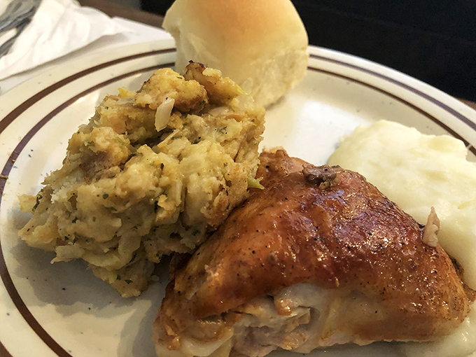 That golden-brown chicken skin crackles with each bite, while the stuffing alongside whispers, "You know you want seconds."
