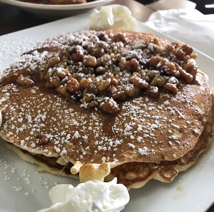 Walnut-topped pancakes dusted with powdered sugar—proof that sometimes the best accessories aren't in your closet but on your breakfast plate.