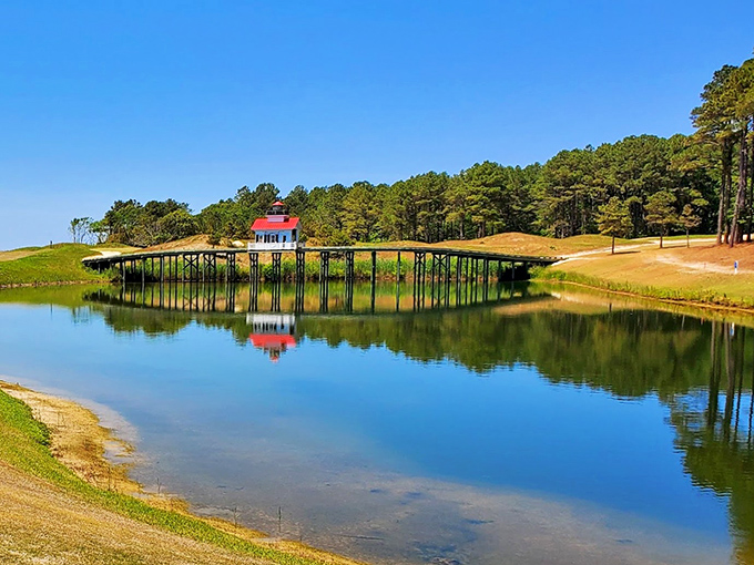 A bridge over tranquil waters leads to that little red building—possibly the world's most picturesque spot for an afternoon nap.