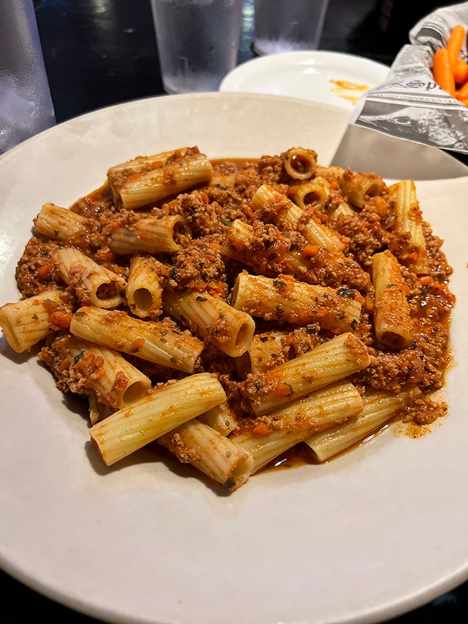 Behold the beef Bolognese in its glory—pasta tubes standing at attention, ready to transport you to Italian grandmother territory without the airfare.