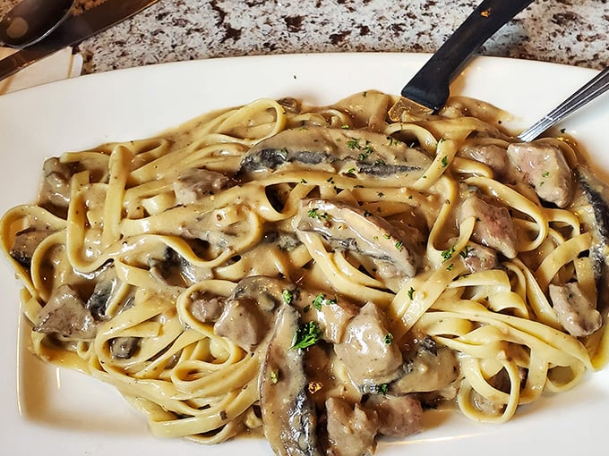 Fettuccine that doesn't just sit on the plate—it beckons, whispering promises of mushroom-infused bliss and tender beef.