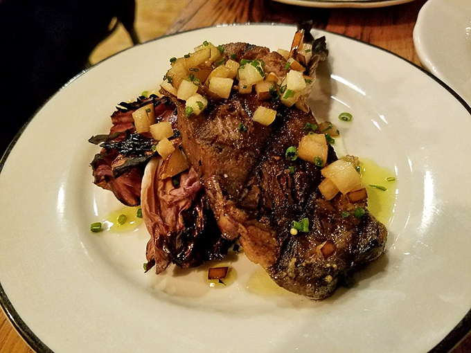 Beef tongue might sound intimidating, but when it's wood-grilled and topped with these bright, acidic cubes of something wonderful, it becomes a gateway to culinary adventure.